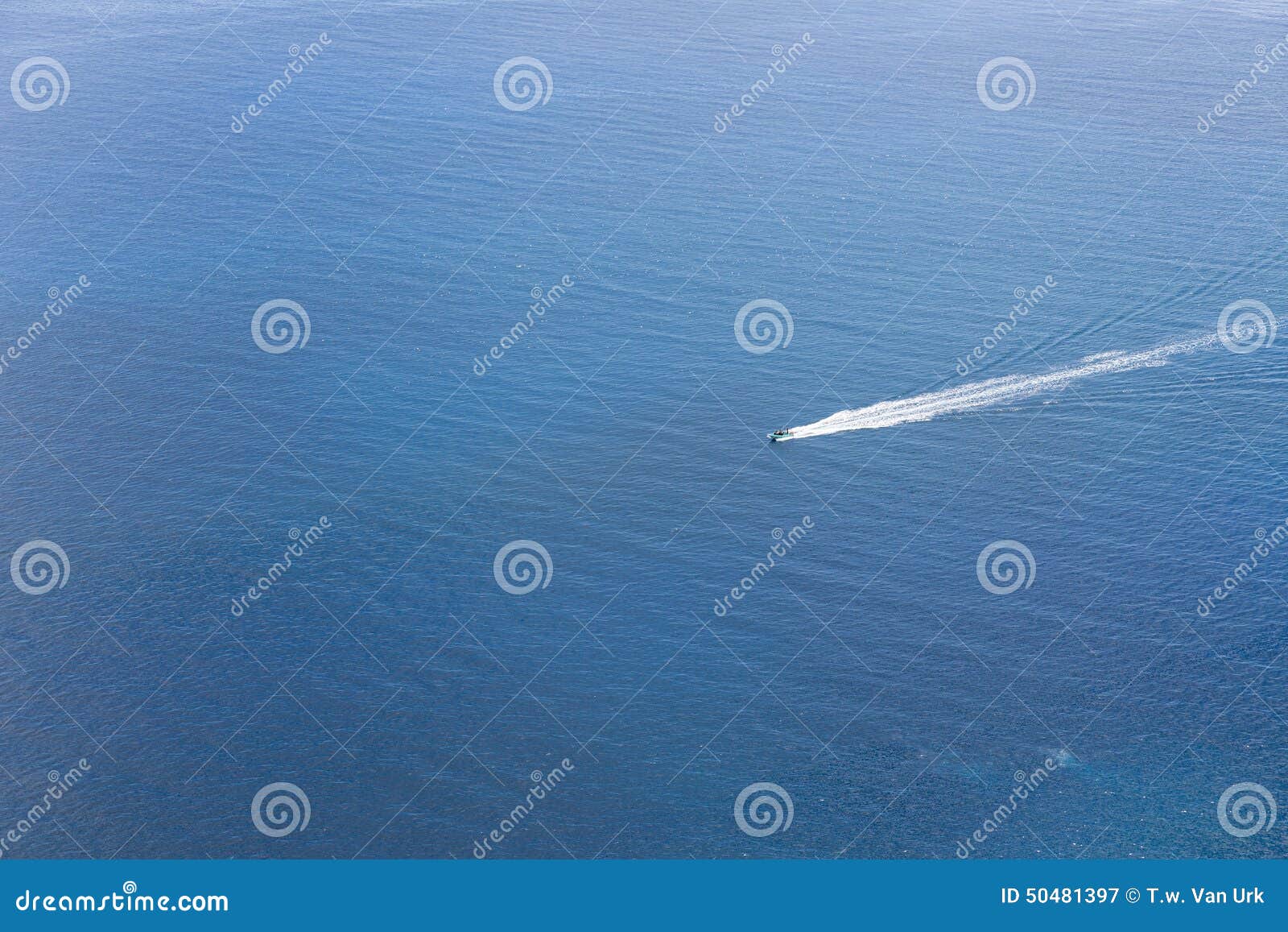 Aerial View of a Small Ship Navigating at a Blue Ocean Stock Image ...