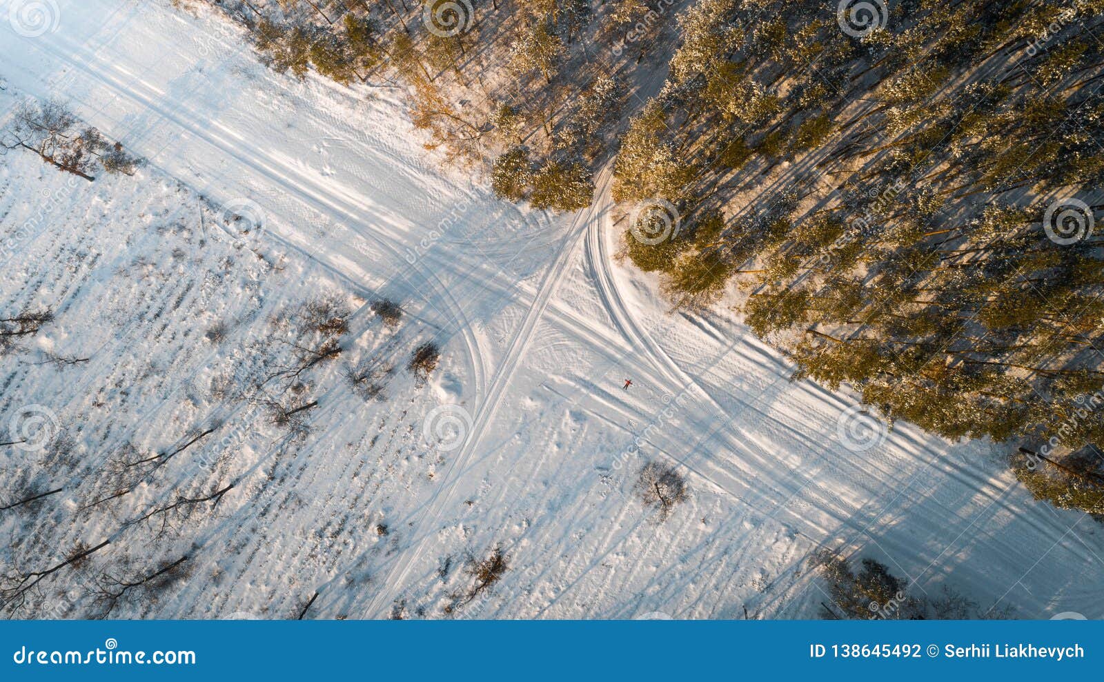 Aerial View of Road Passing through the Snow-covered Winter Forest. Top ...