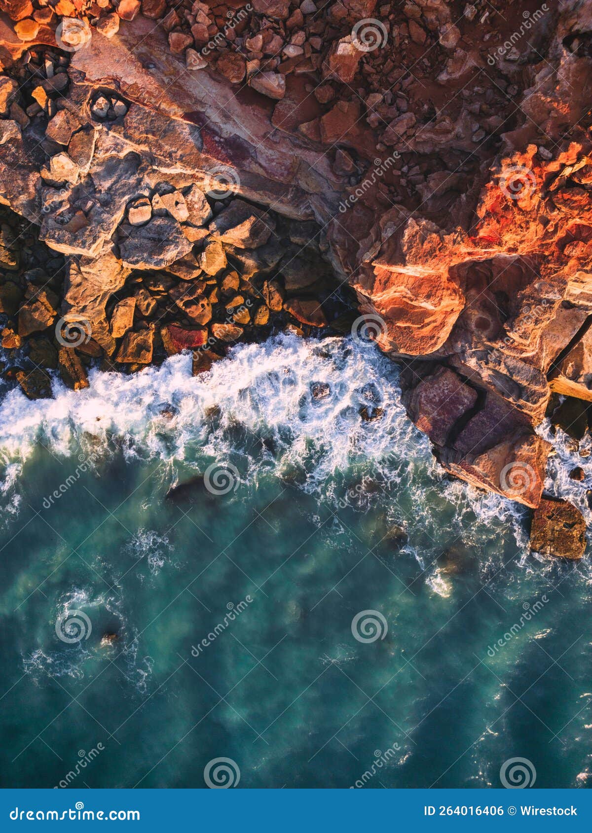 Aerial View of Soft Ocean Waves Splashing Over the Rocks on the Beach ...