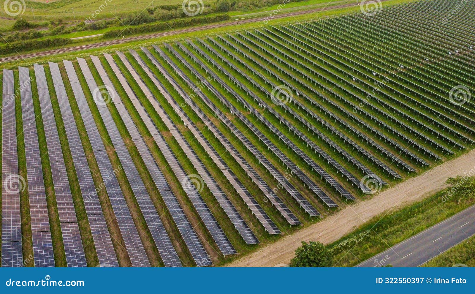 Aerial View of Solar Panels with Railway Tracks in Background Stock ...