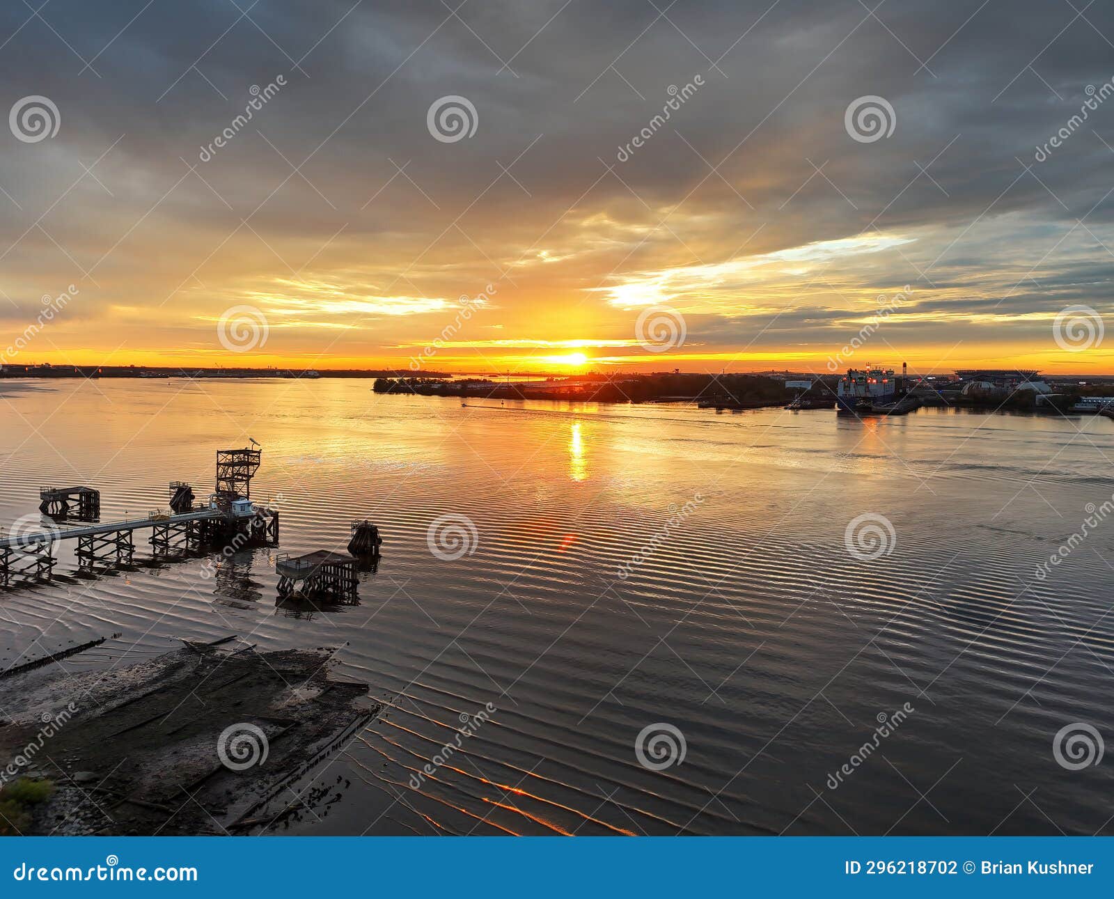 Aerial View of Sun Setting Over the Water Stock Photo - Image of river ...