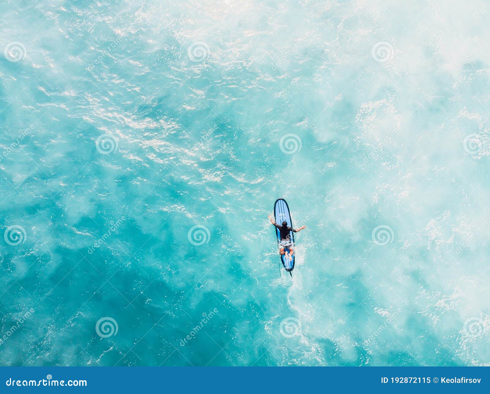 Aerial View of Surfer on Surfboard Rowing in Ocean. Top View Stock ...