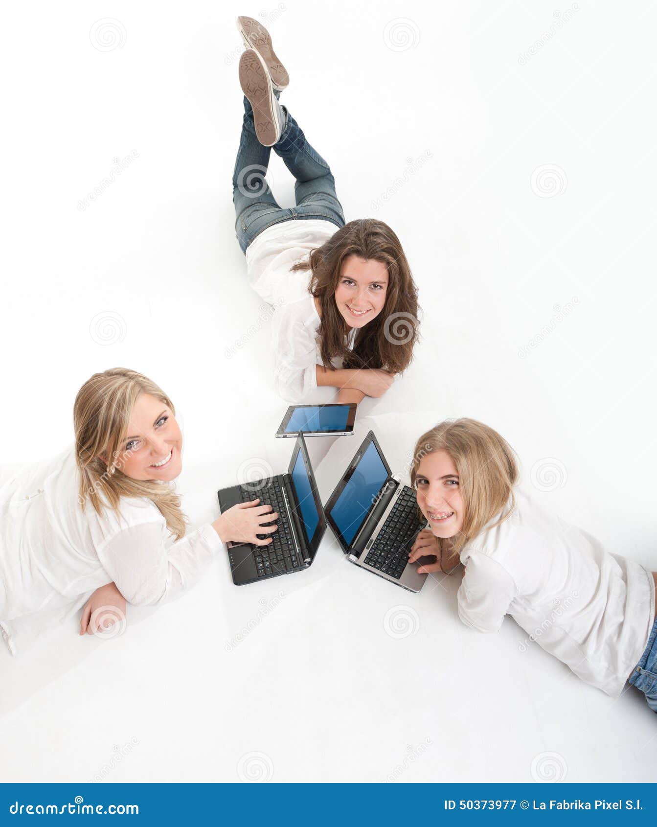 Aerial View of Three Smiling Girls with Computer Stock Image - Image of ...