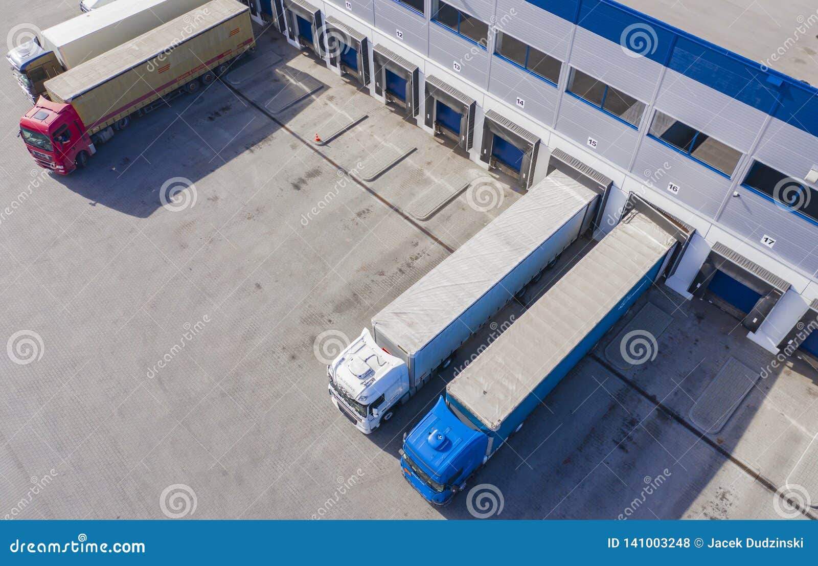 Aerial View of Trucks Unloading in Logostics Center Stock Photo - Image ...
