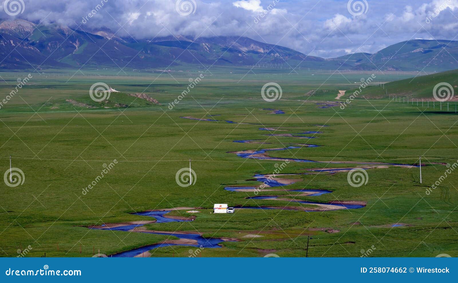 Aerial View of a Twisting Stream through a Vast Grassland in Tibet ...