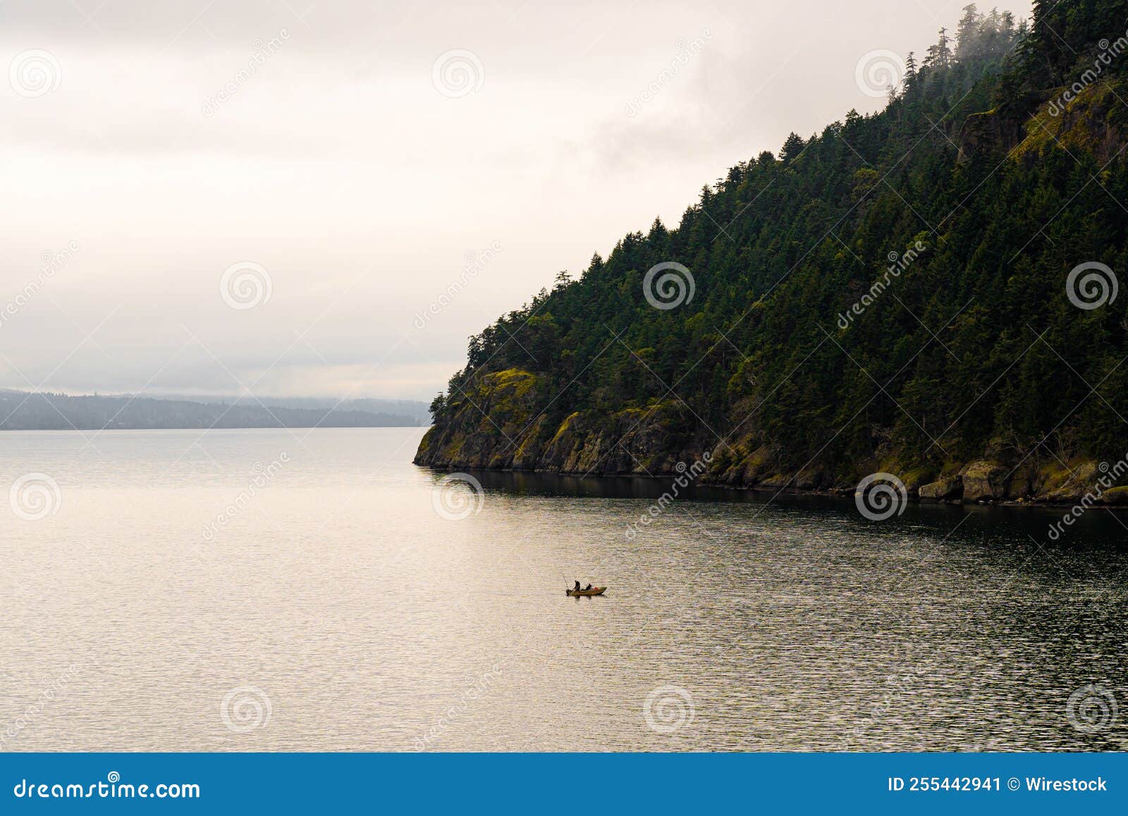 Aerial View of Two Men in Fishing Boat at a Distance Near Steep Coastal ... Aerial View of Two Men in Fishing Boat at a Distance Near Steep Coastal ...