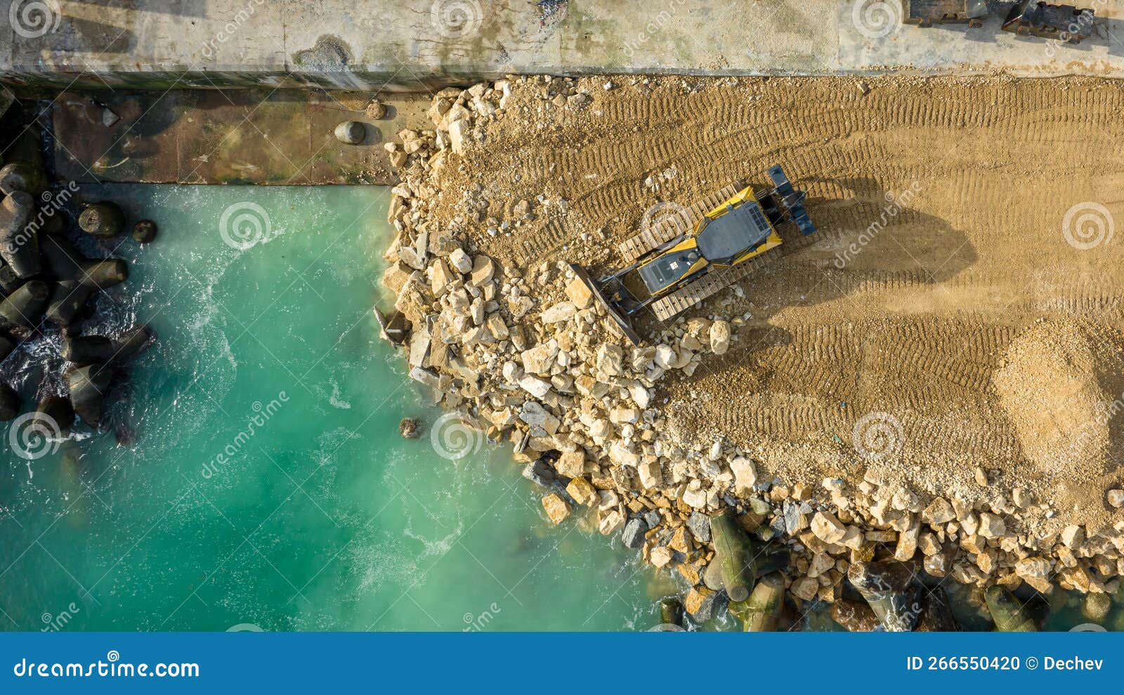 Aerial View of Waterfront Construction Site with Excavator. Bulldozer ...