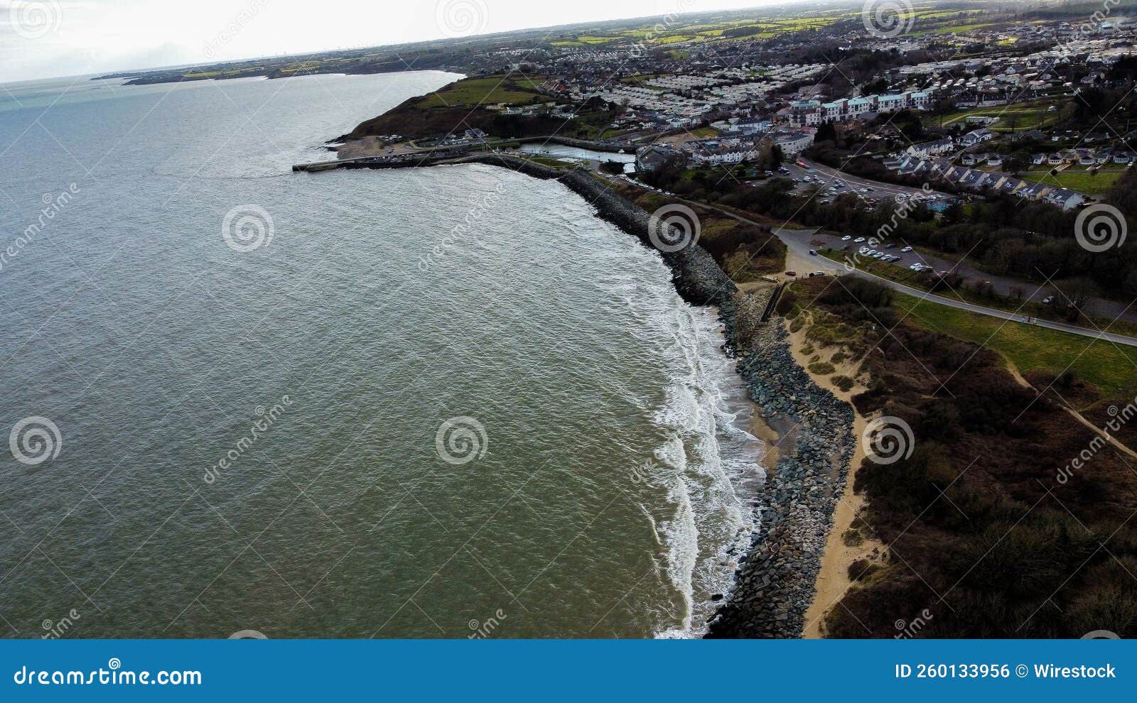 Aerial View of the Waves Hitting the Coast and the Cityscape in the UK ...
