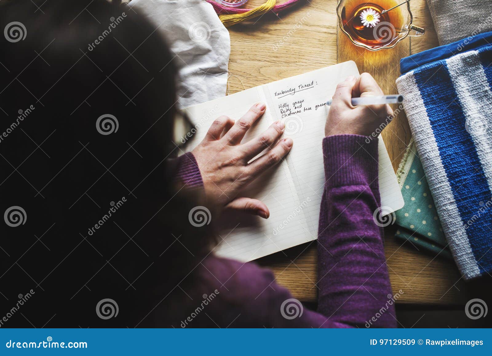 Aerial View of Woman Writing Thread Color List on Notebook Stock Image ...