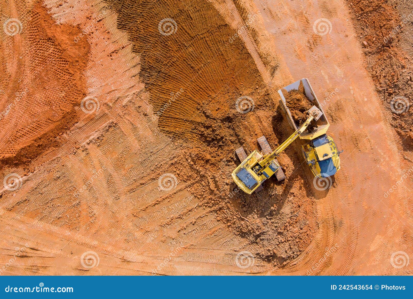Aerial View of Bulldozer is Scraping a Layer of Soil and Excavator is ...