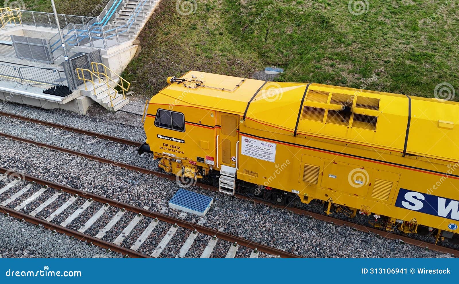 Aerial View of a Yellow Train on the Tracks at EWR Winslow Station ...