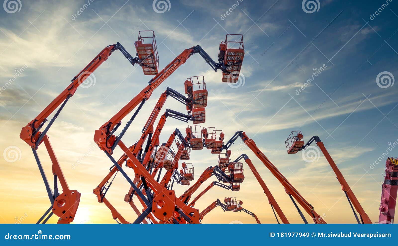 Aerial Work Platforms Lined Up of Cherry Picker Against Blue Sky with ...