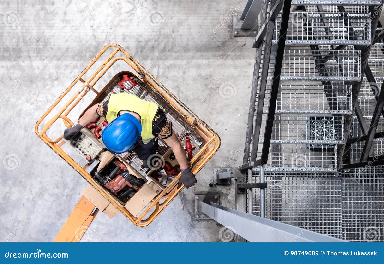 Worker On A Cherry Picker, Together With Telescopic Crane, Installs A ...