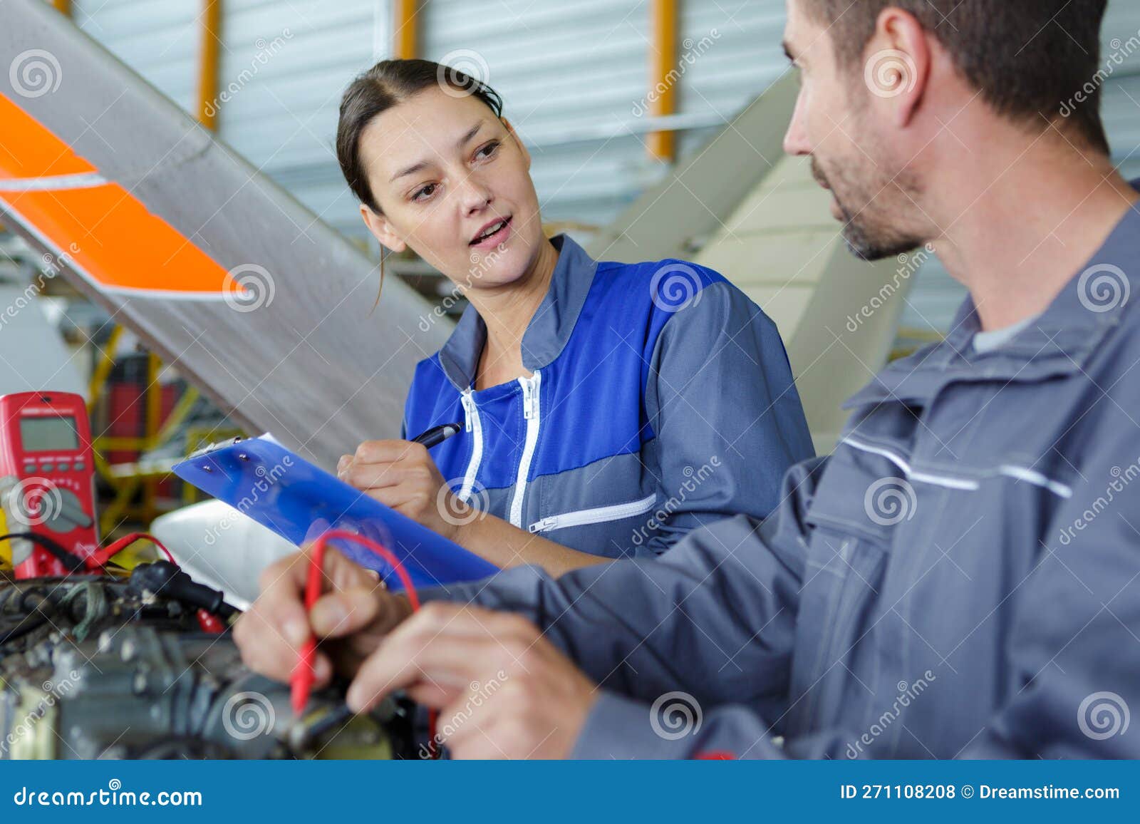 Aero Engineer and Apprentice Working in Hangar Stock Photo - Image of ...