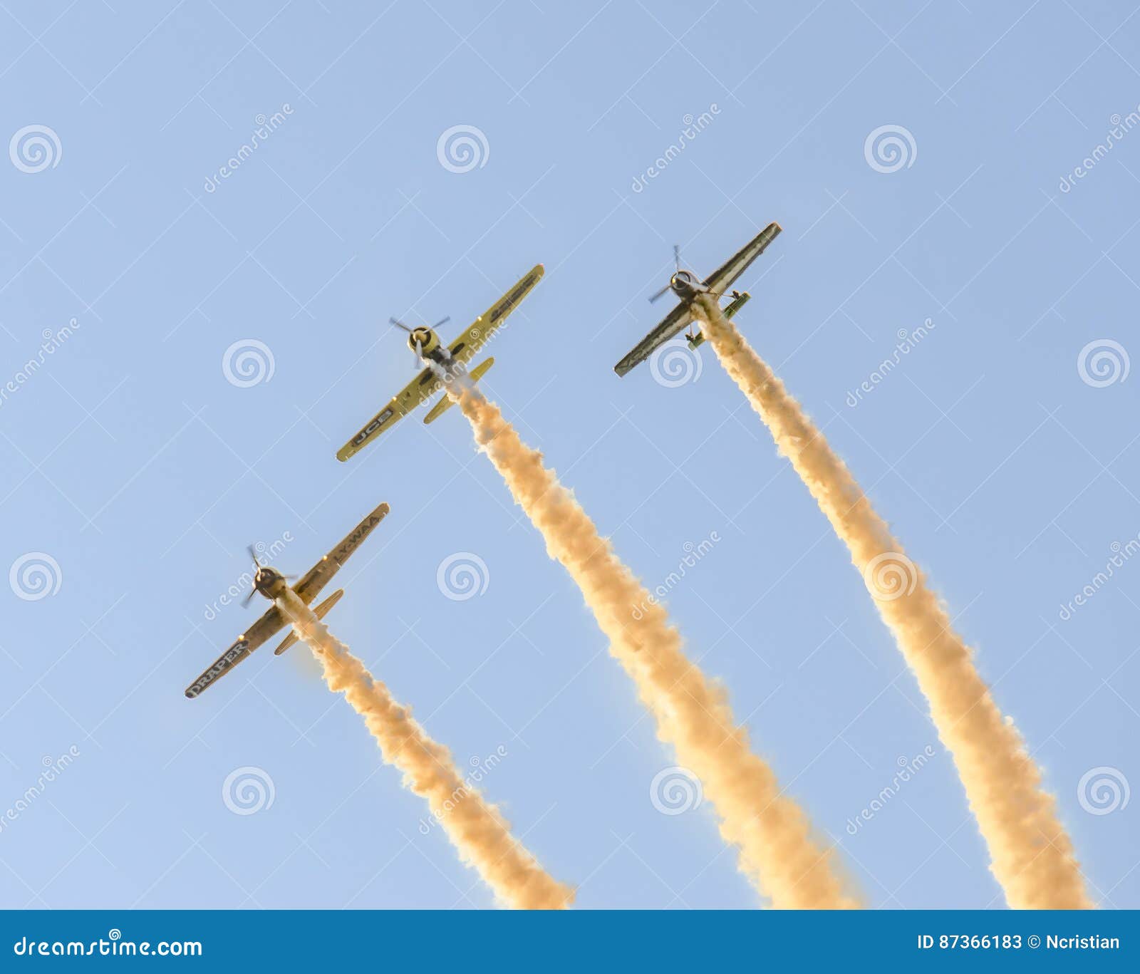 Aerobatic Pilots Training in the Blue Sky, Airplanes with Colored Trace ...