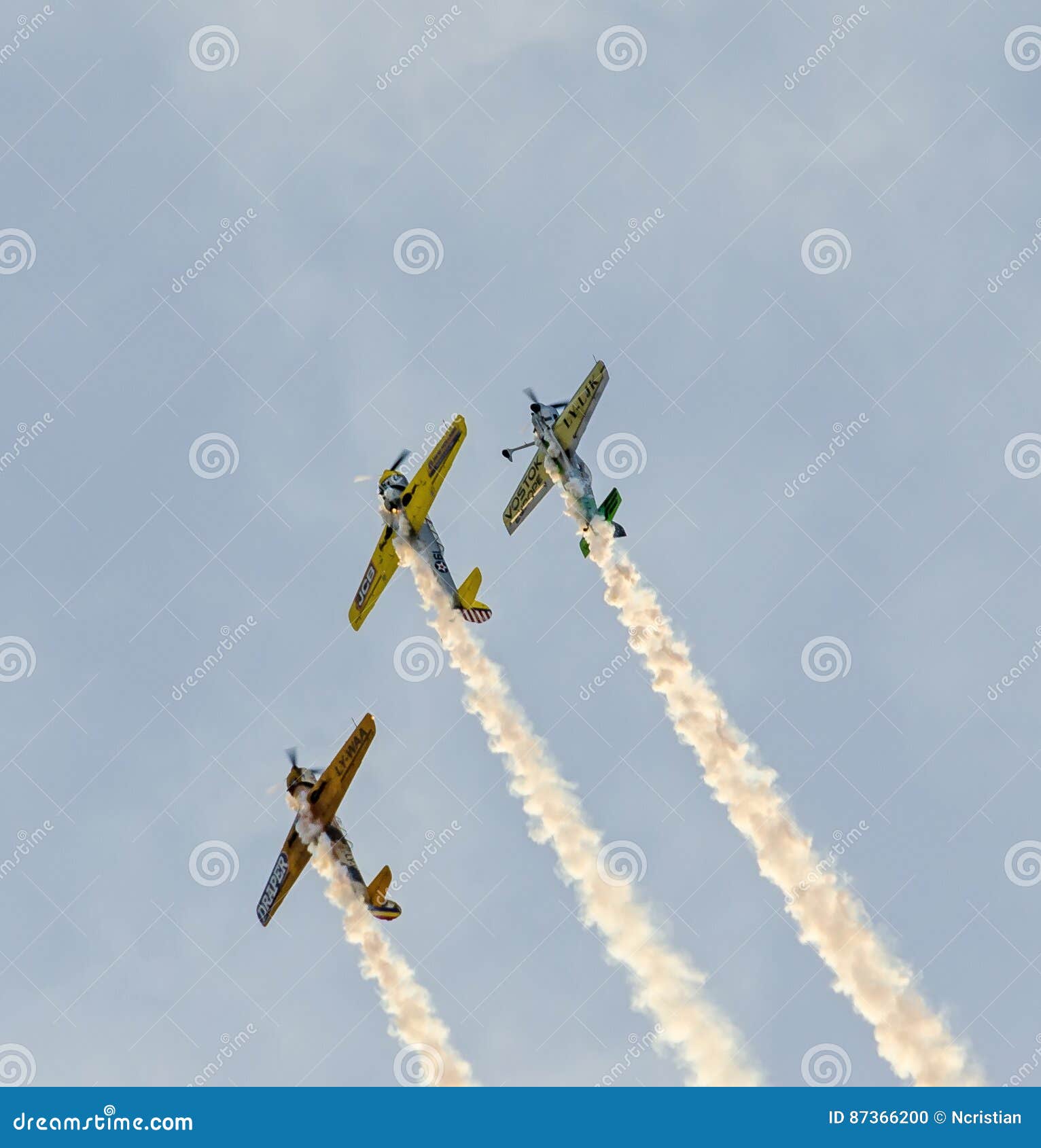 Aerobatic Pilots Training in the Blue Sky, Airplanes with Colored Trace ...