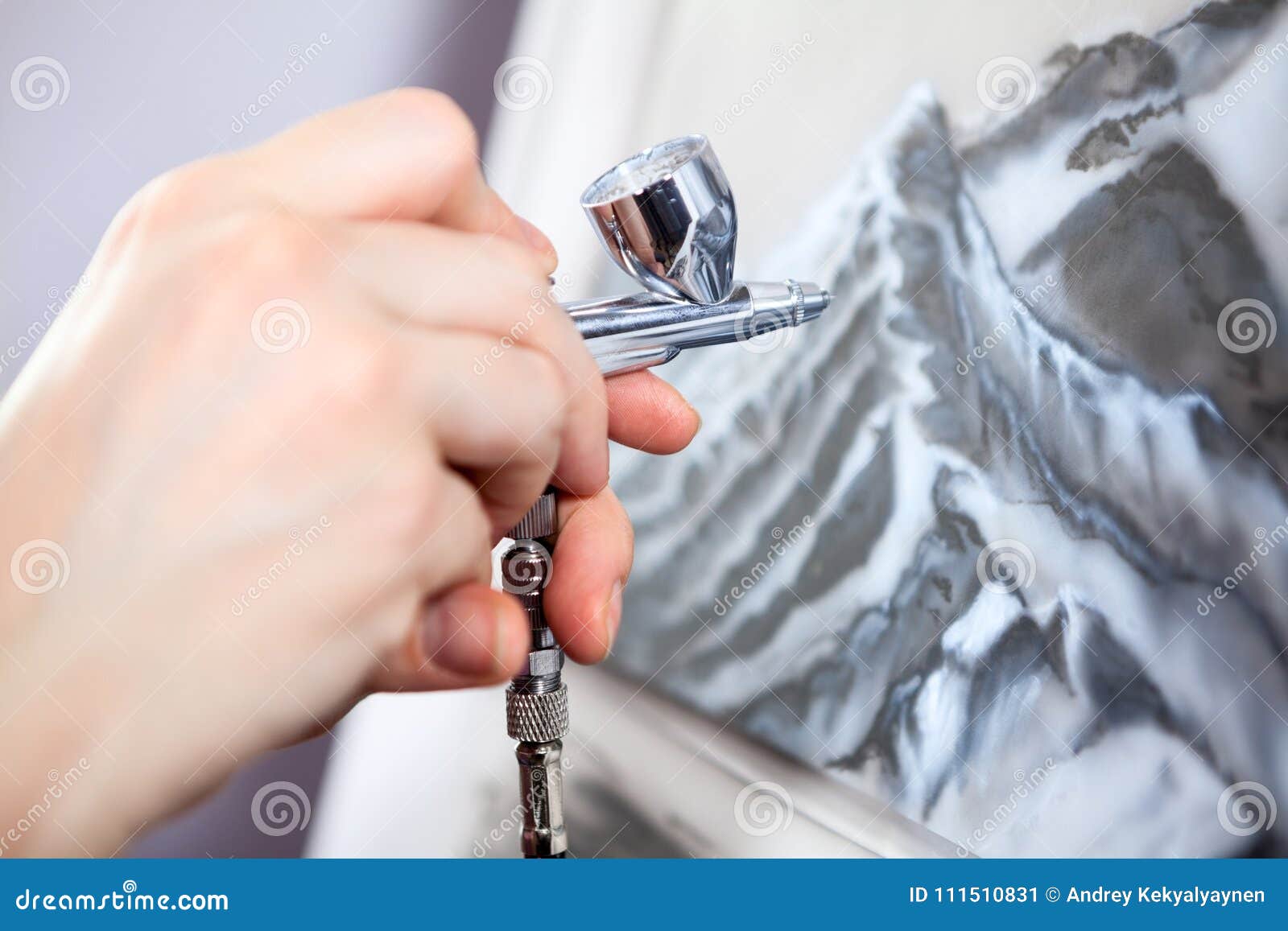 An Aerograph Unit or Paint Sprayer in Human Hand Drawing on Canvas ...