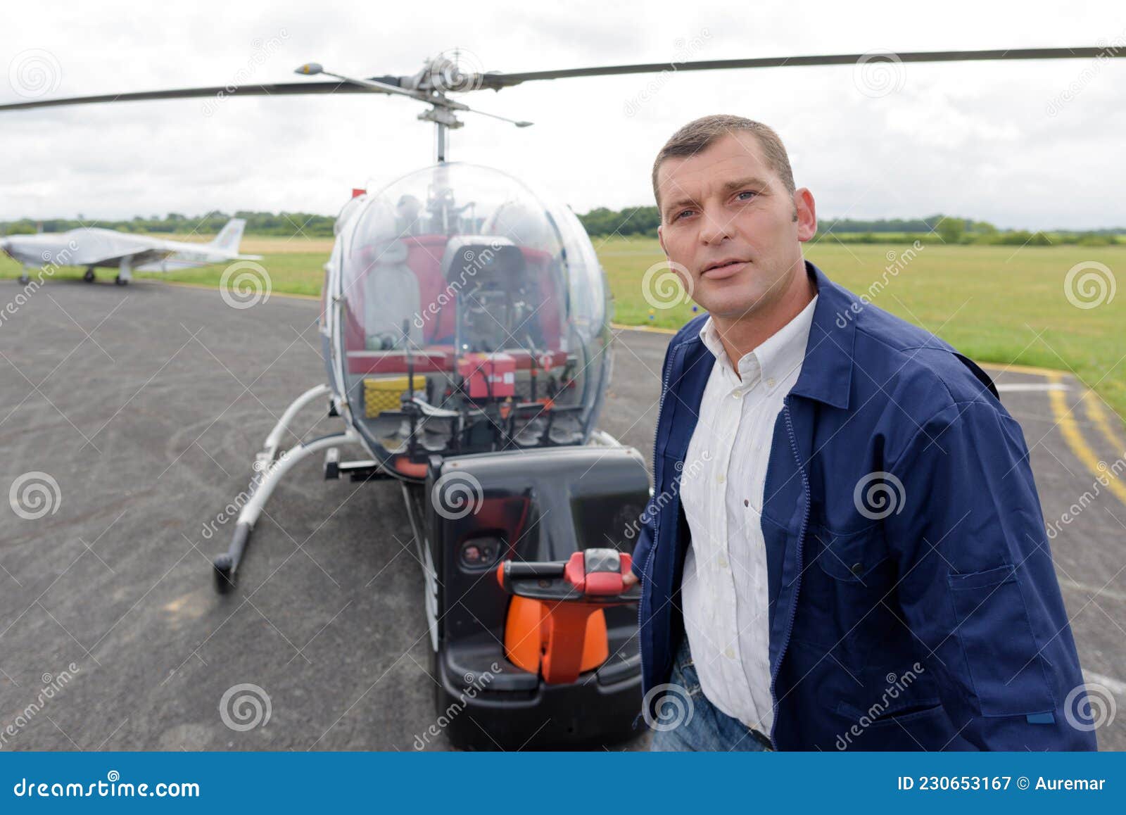 Aeronautic Technician Hauling Helicopter Stock Image - Image of ...