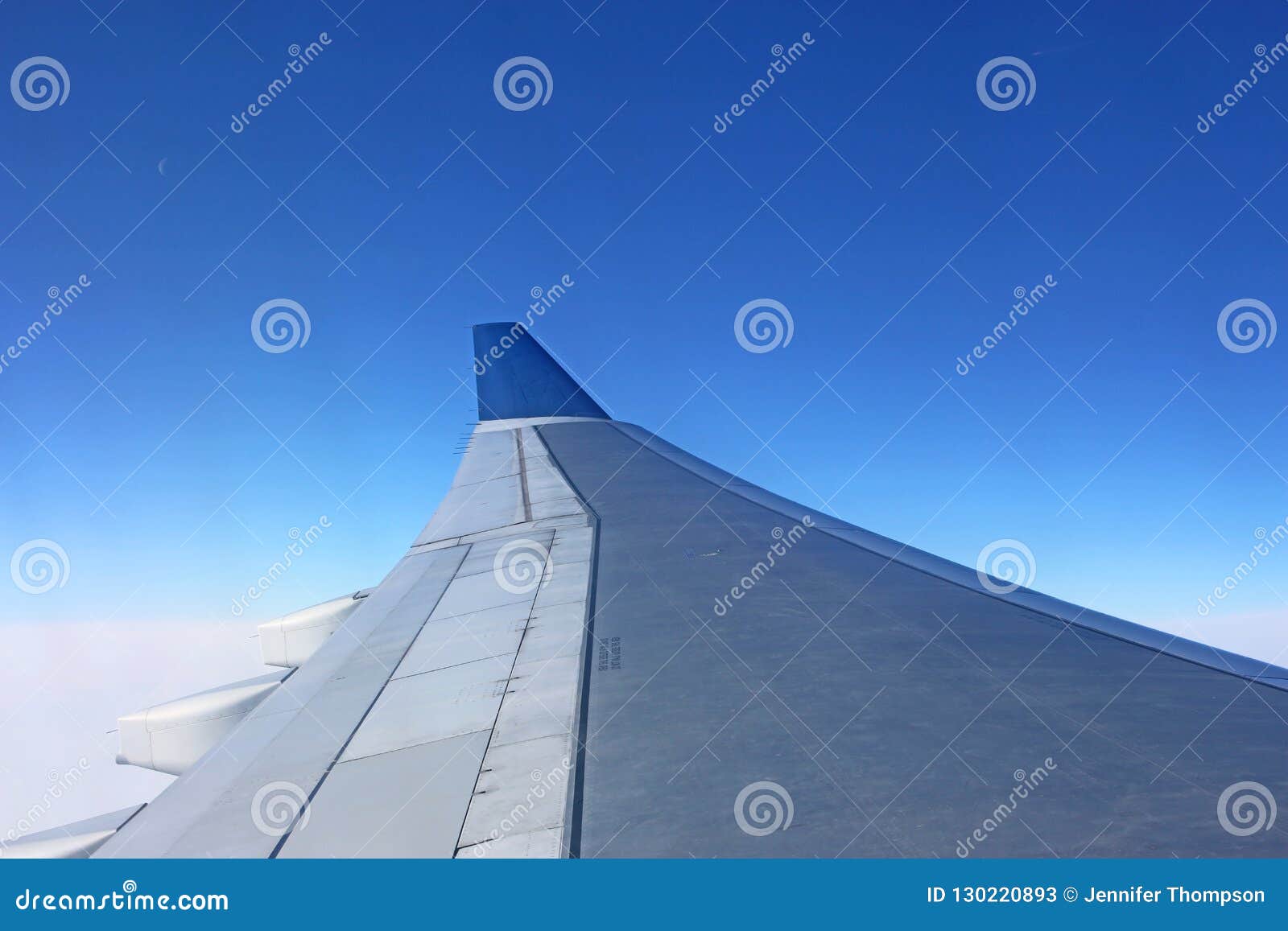 Airplane wing in the sky stock image. Image of wing - 130220893