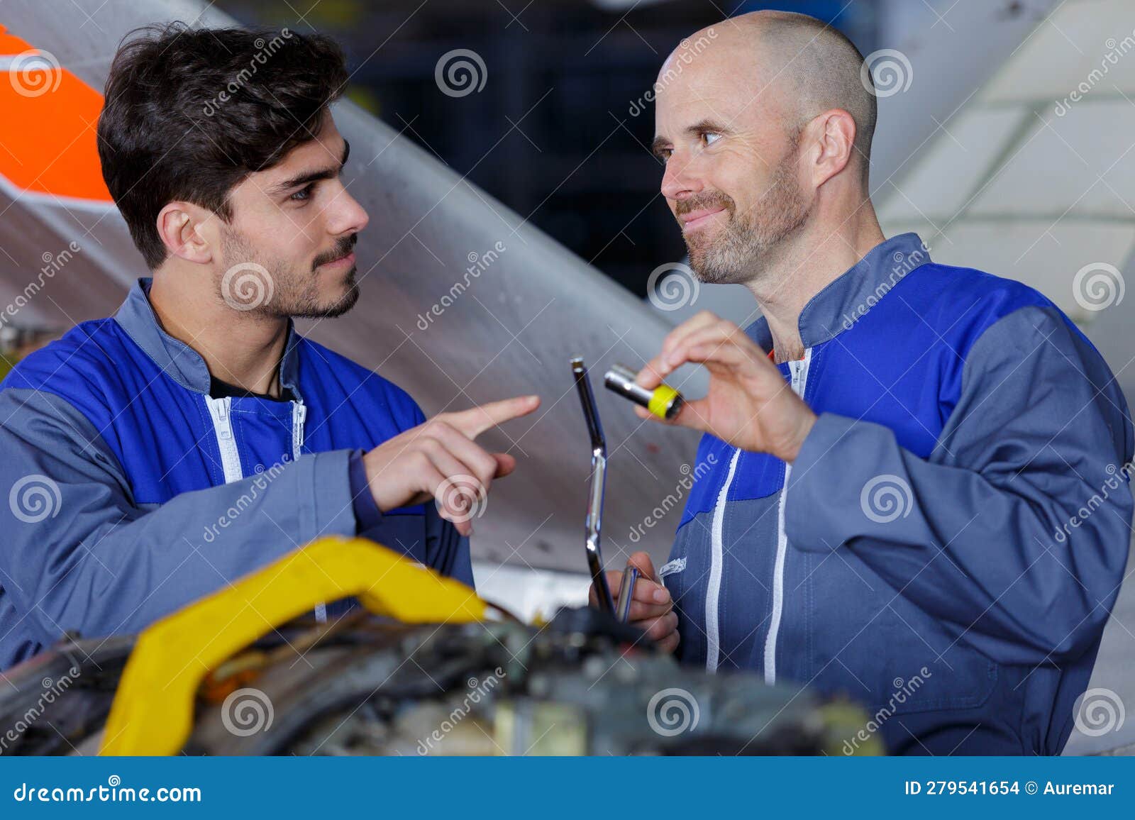 Aerospace Engineers Using Lamp To Work on Aircraft Engine Stock Photo ...