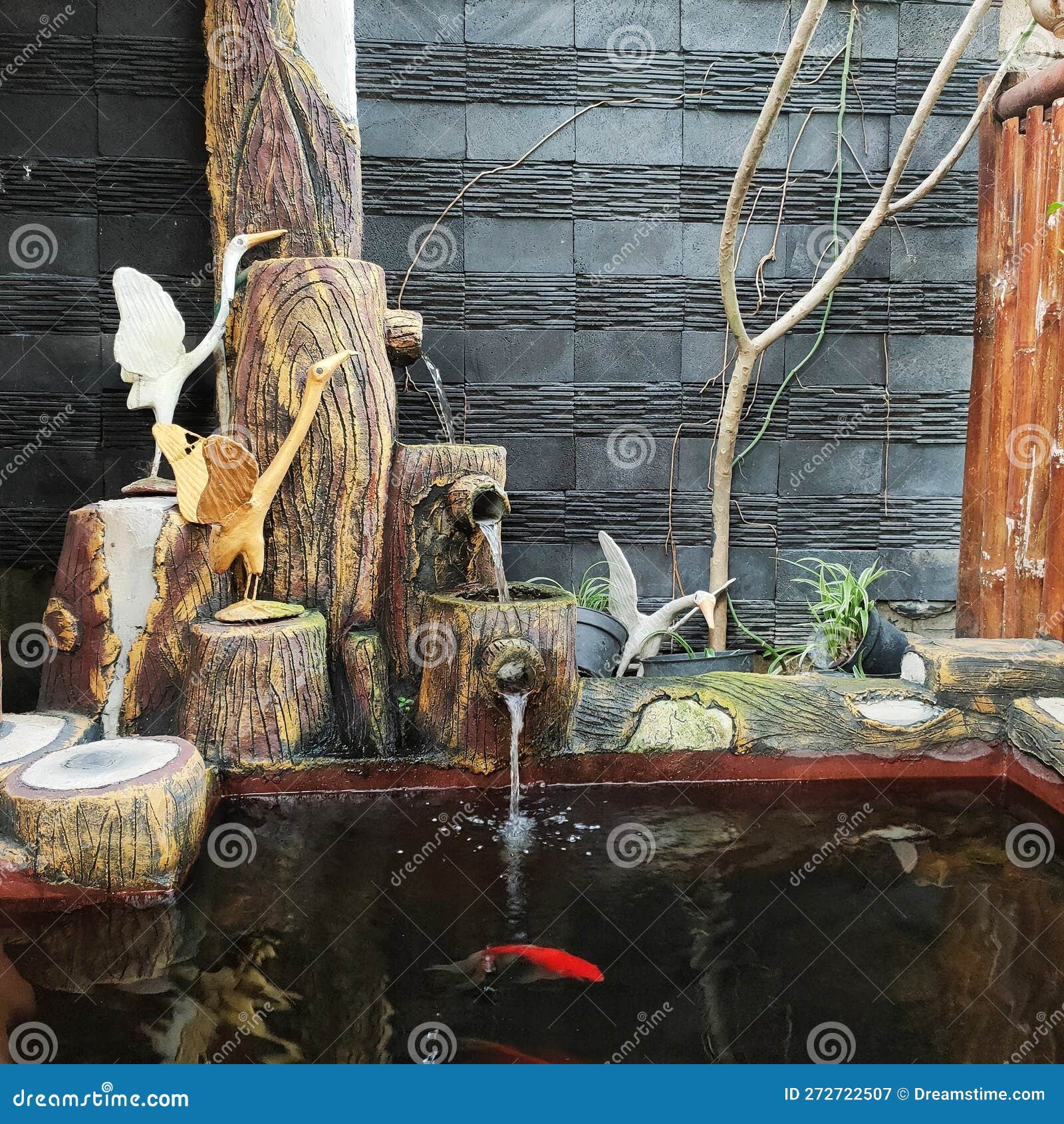 Aesthetic Fish Pool with Wood Ornament from Cement Stock Image - Image ...