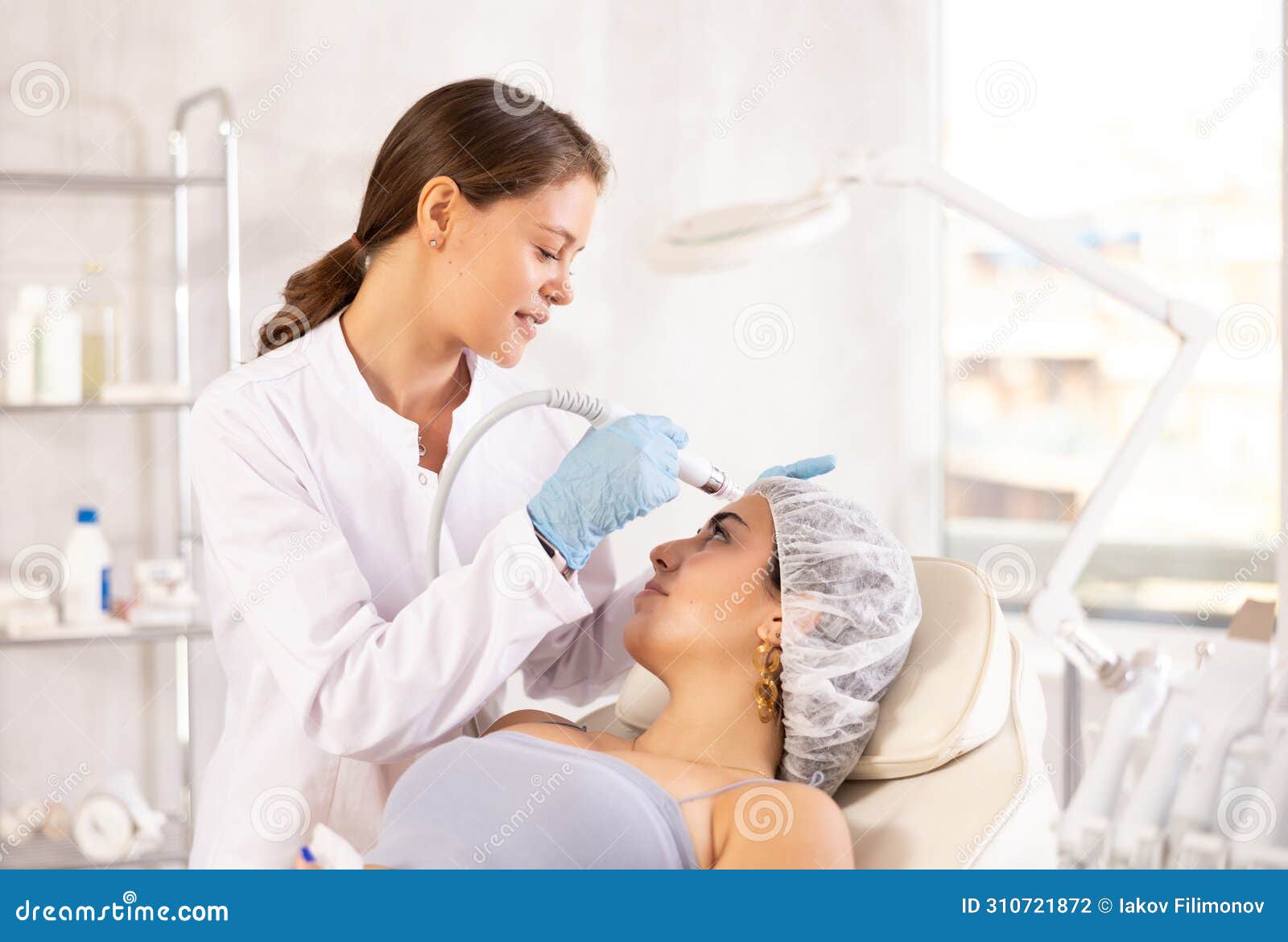 Aesthetician Administering Facial Procedure on Woman Using Ion Bubble ... Aesthetician Administering Facial Procedure on Woman Using Ion Bubble ...