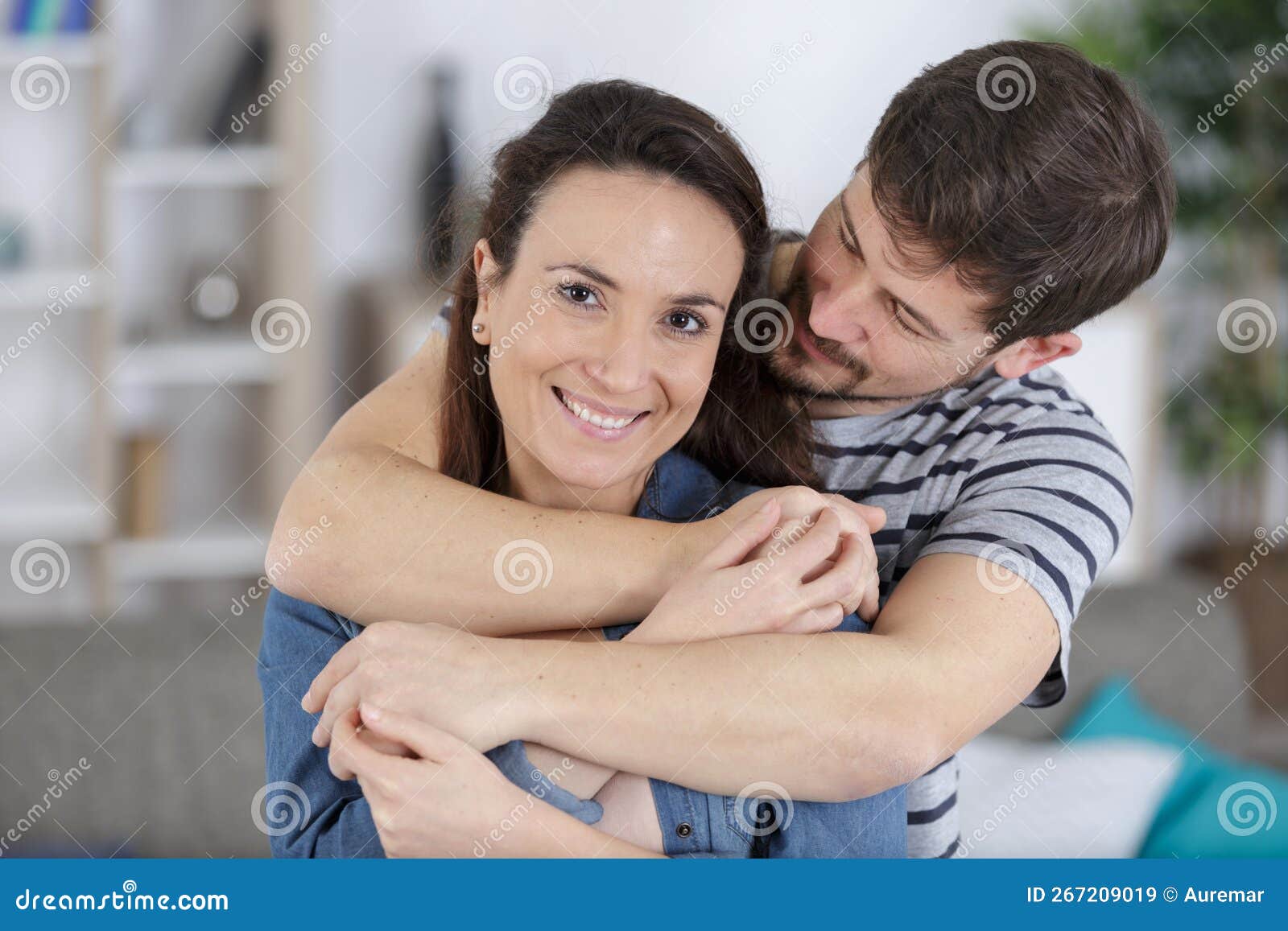 Affectionate Couple Embracing Woman Looking at Camera Stock Image ...