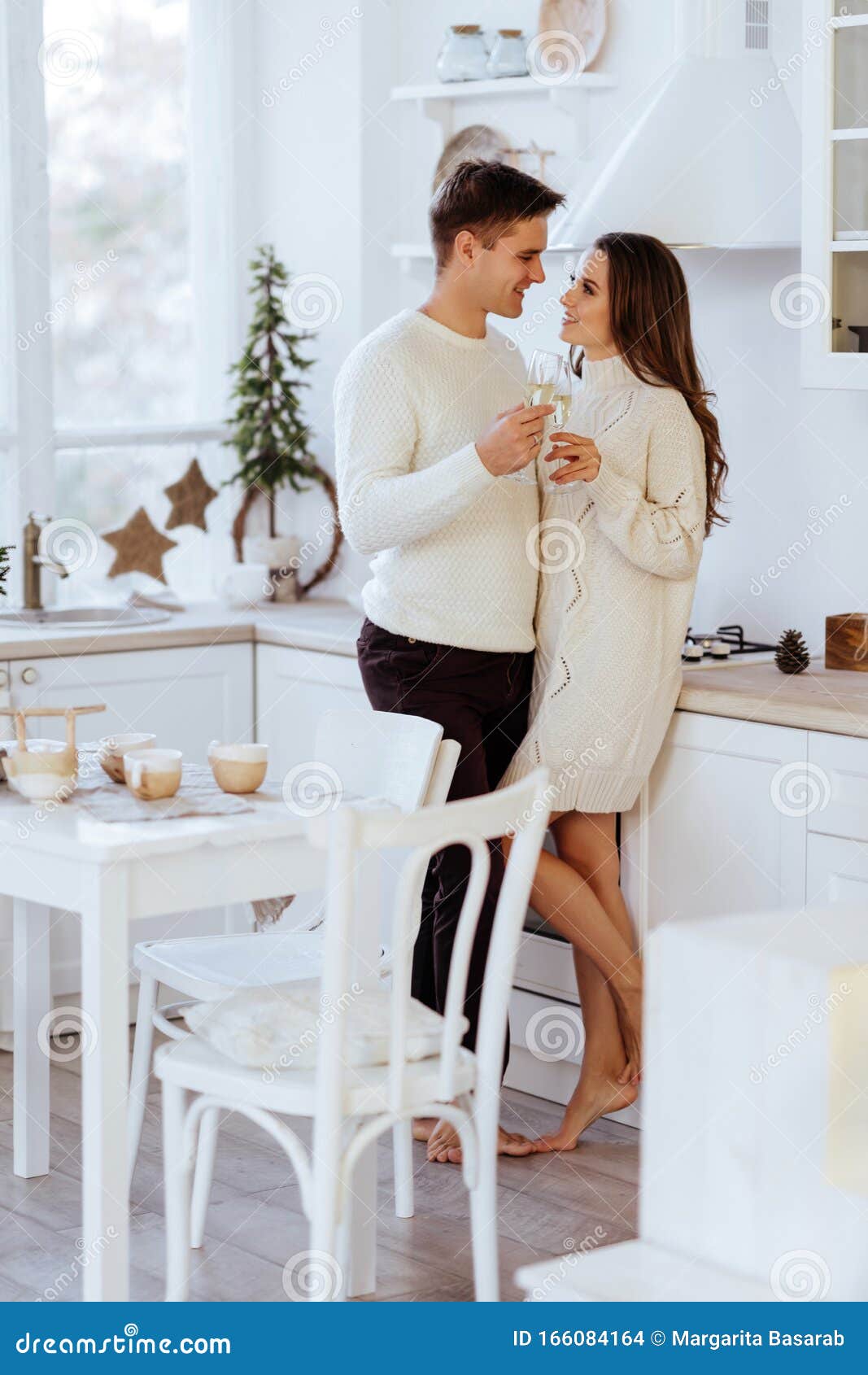 Affectionate Couple Hugging in Kitchen Stock Photo - Image of holiday ...