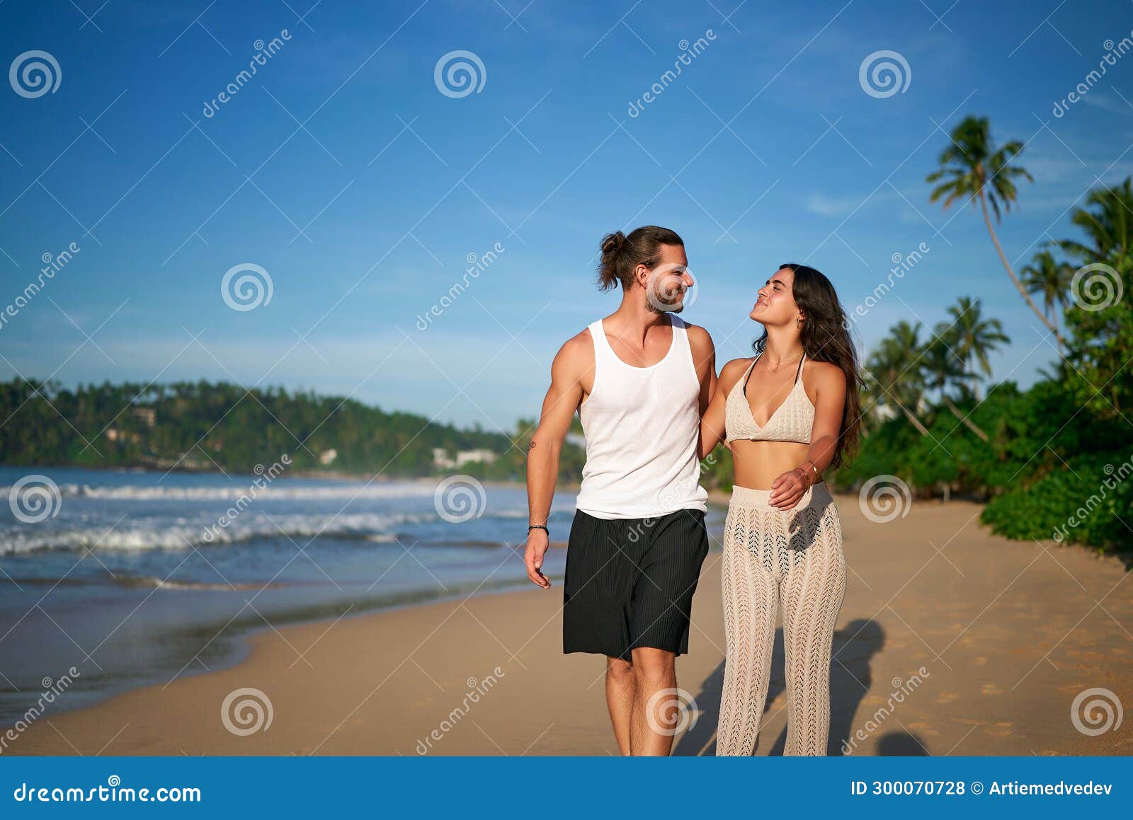Affectionate Couple Stroll On Sandy Beach Man And Woman In Summer
