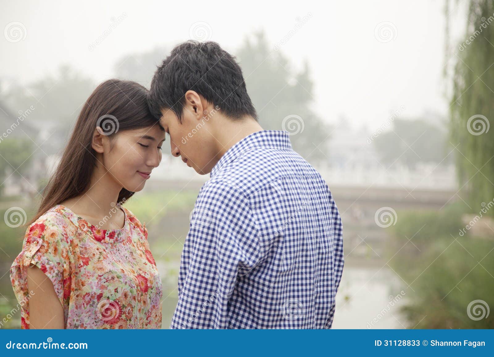 Affectionate Couple Touching Heads by a Canal Stock Image - Image of ...