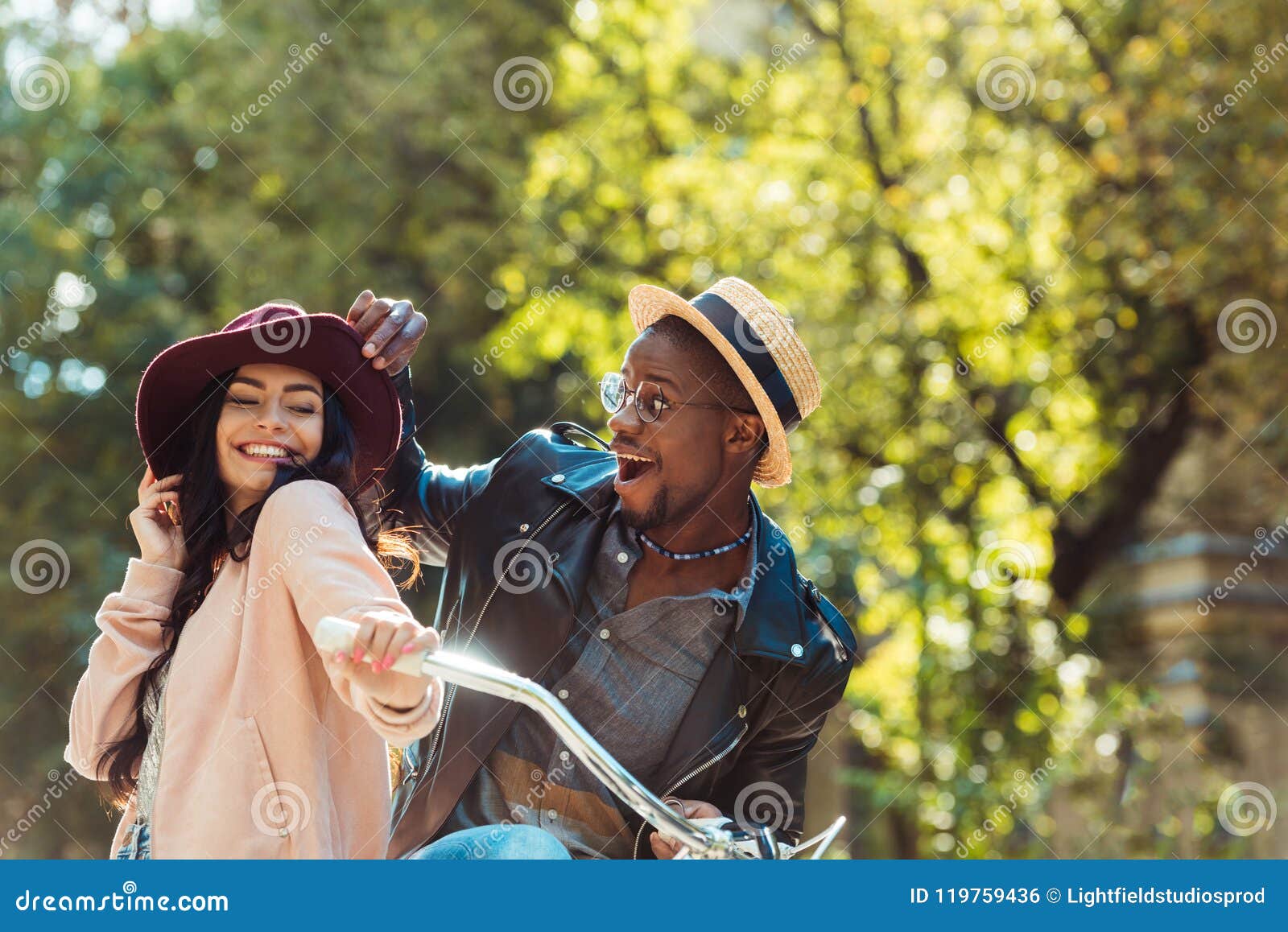 Affectionate Interracial Couple Laughing And Standing Together Stock
