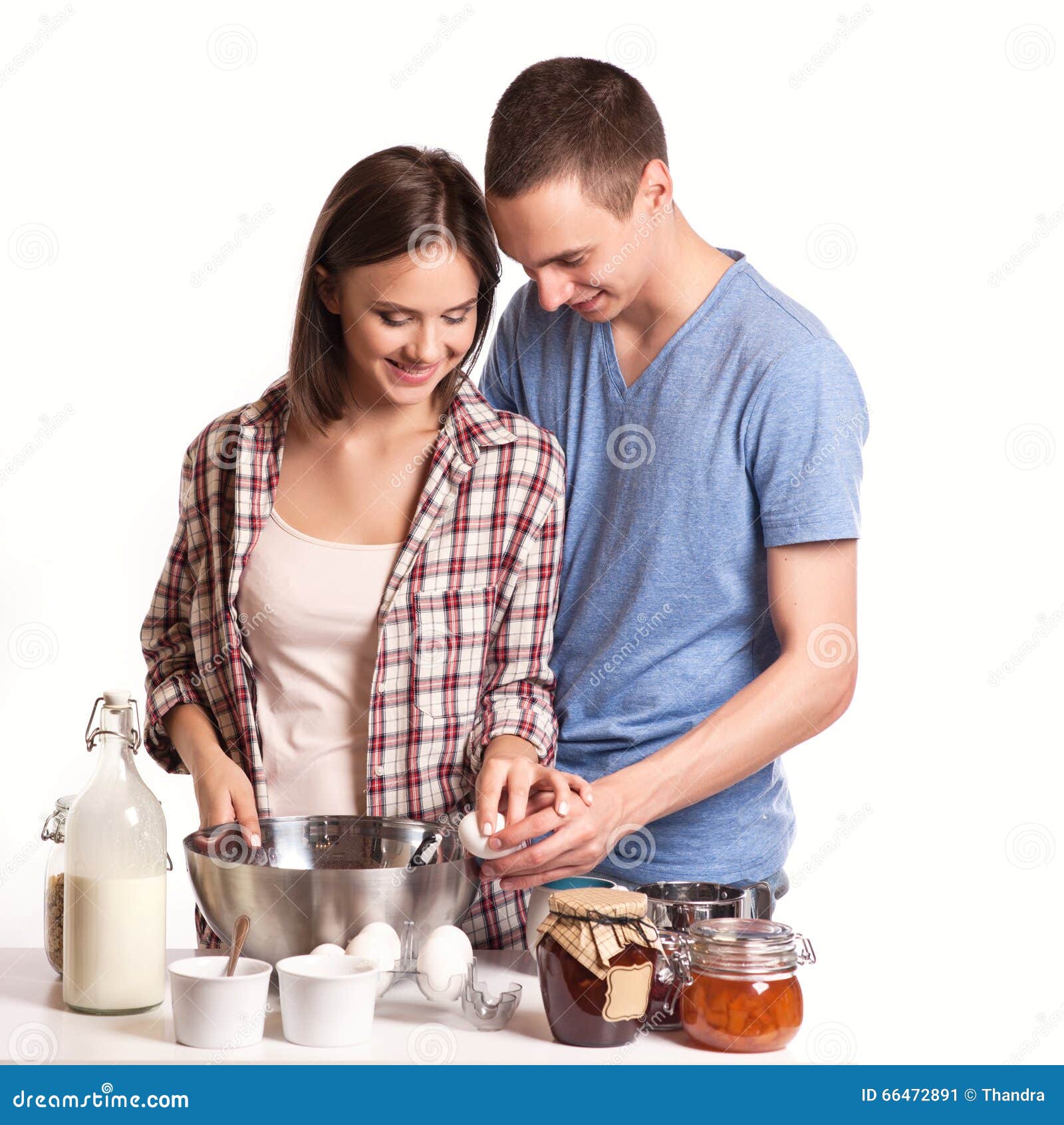 Affectionate Man Kissing His Girlfriend while Cutting Bread for ...