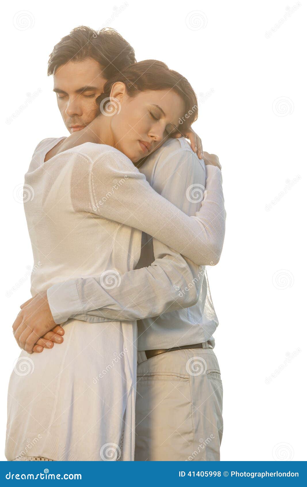 Affectionate Young Couple with Eyes Closed Hugging in Park Against ...
