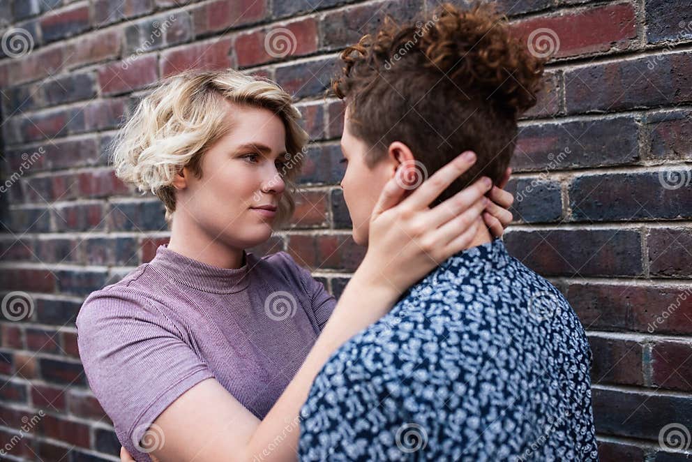 Affectionate Young Lesbian Couple Looking Into Each Other`s Eyes