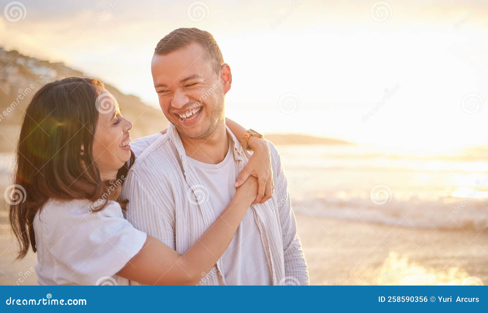 Affectionate Young Mixed Race Couple Sharing An Intimate Moment On The