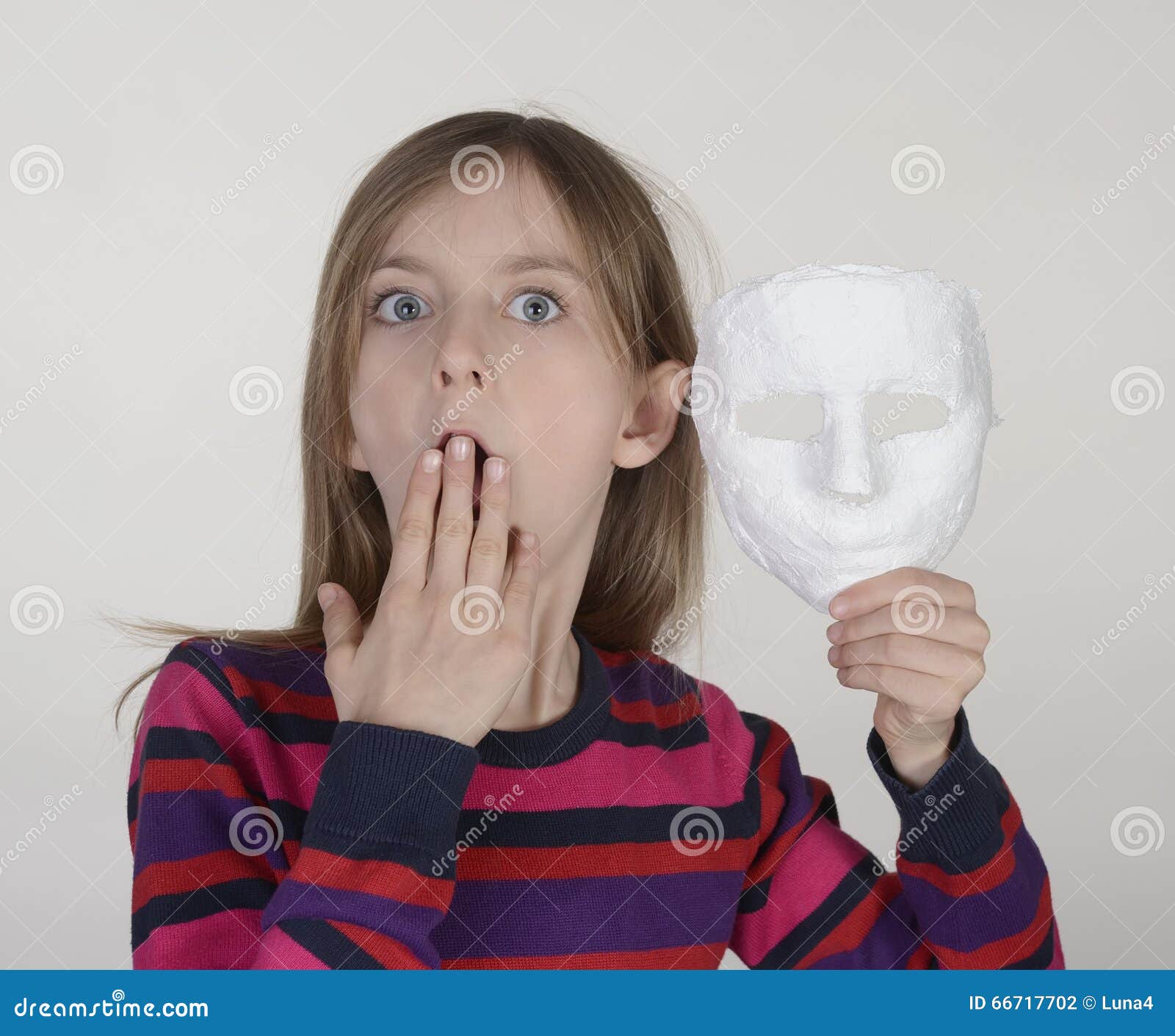 Afraid girl with mask stock photo. Image of spiritism - 66717702