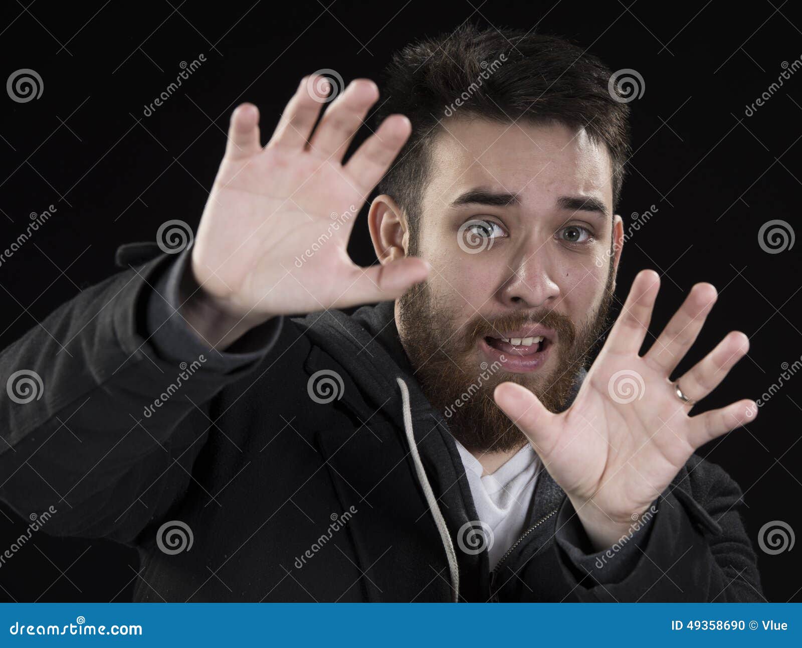 Afraid Young Man with Hands Up Stock Photo - Image of apprehensive ...