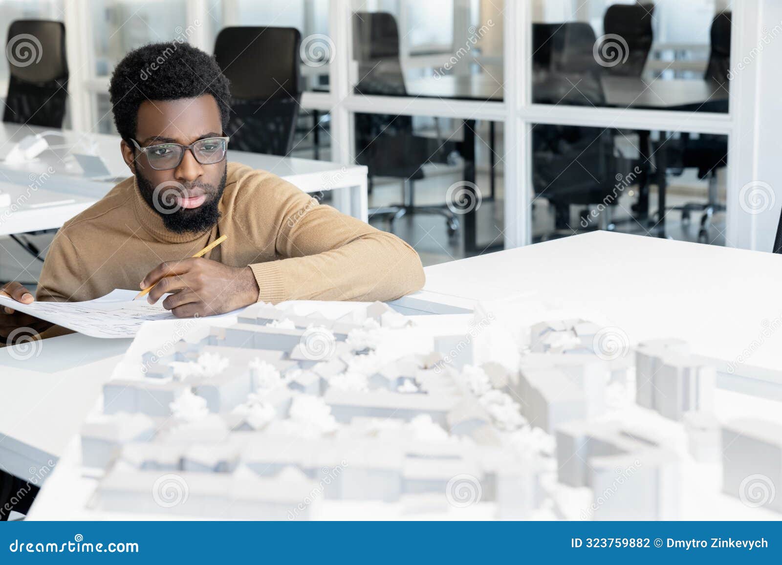 African American Architect Thinking on a Miniature and Looking Thoughtful Stock Photo - Image of ...
