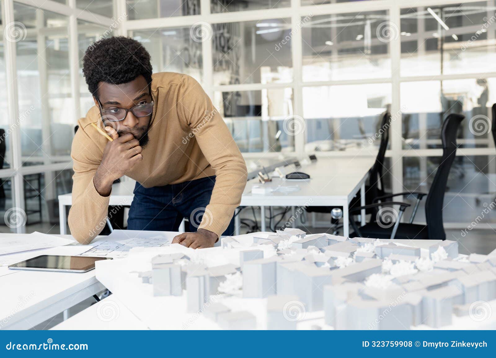 African American Architect Thinking on a Miniature and Looking Thoughtful Stock Photo - Image of ...