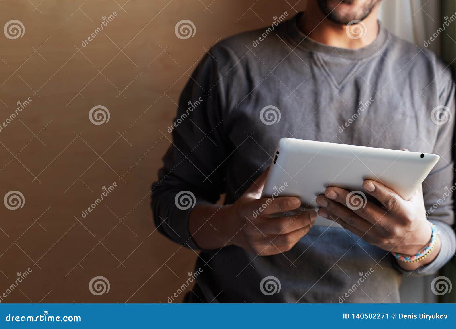 African American Black Man Using Electronic Tablet at Home Stock Image ...