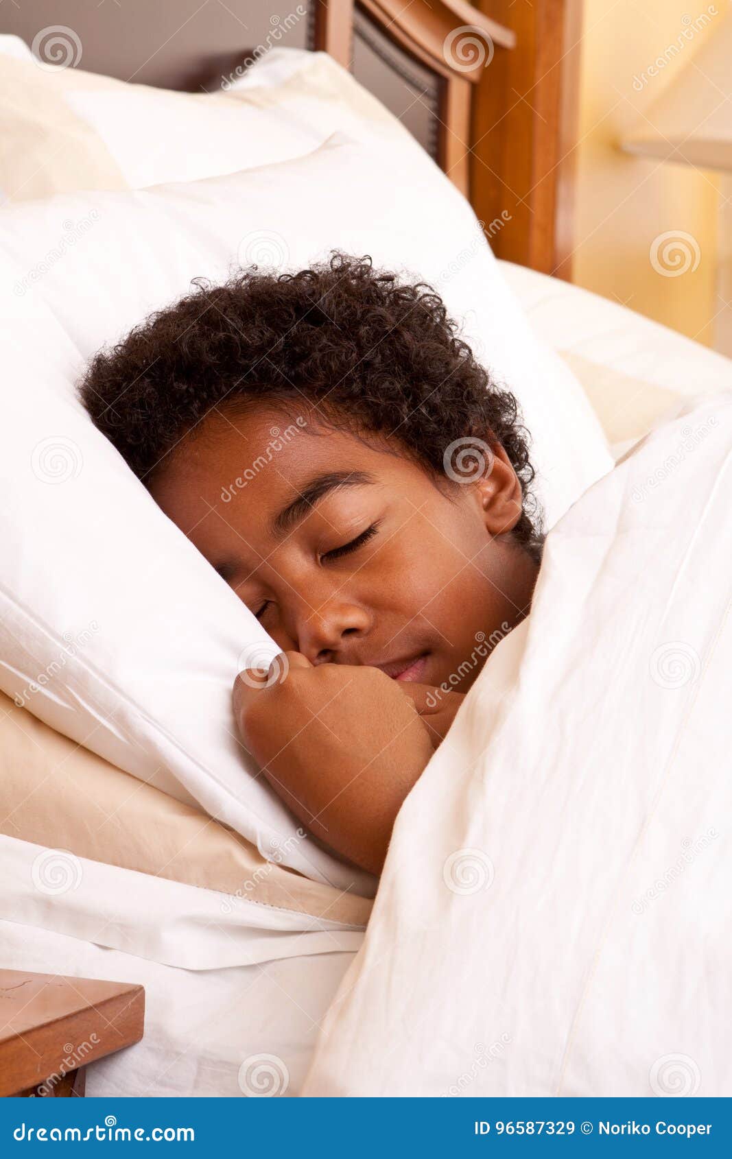 African American Boy Sleeping in His Bed. Stock Image - Image of ...