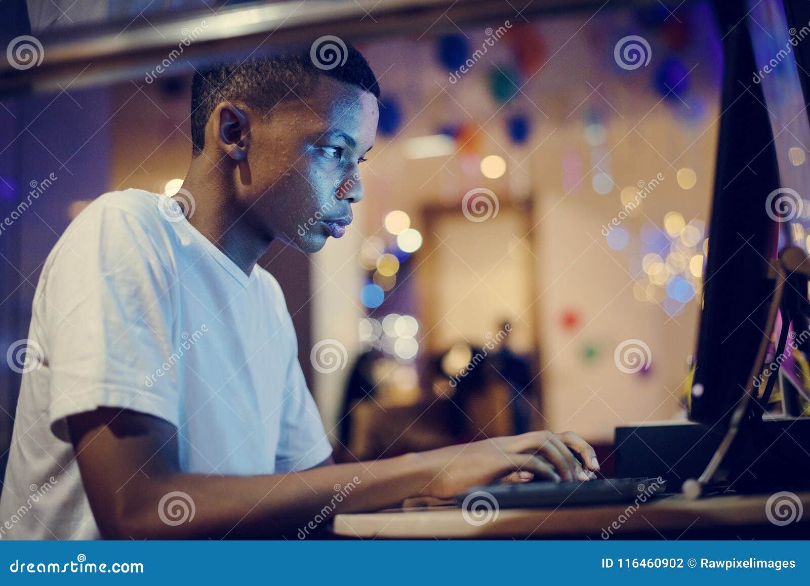 African American Boy Using a Computer at Night Stock Photo - Image of ...