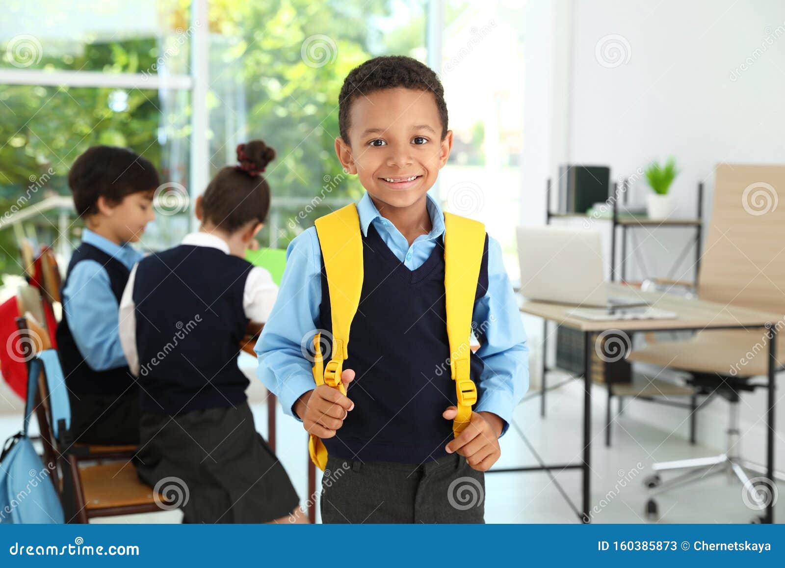 African-American Boy Wearing School Uniform with Backpack Stock Image ...
