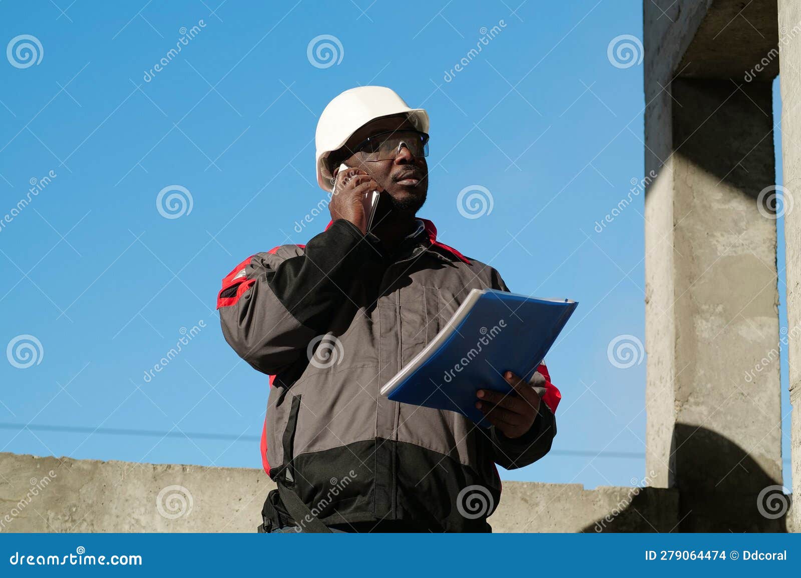 African American Builder with Work Papers Talks on Smartphone Stock ...