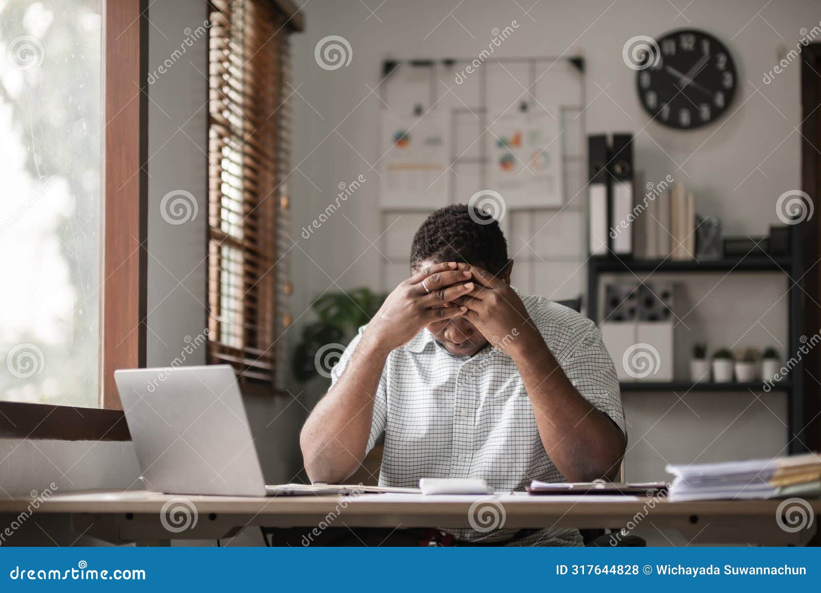 African American Businessman Feeling Stressed while Working Using ...
