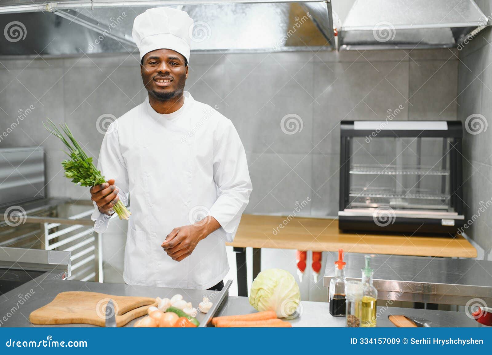 African American Chef Looking at Camera at Restaurant Kitchen Stock ...