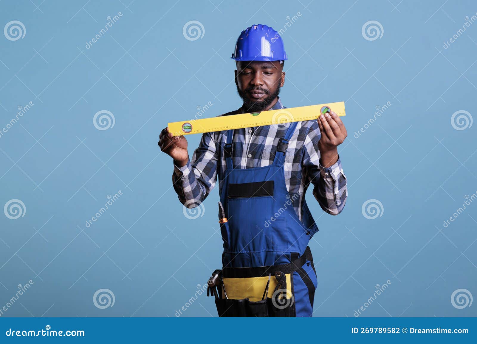 African American Construction Worker Holding Leveler Stock Photo ...