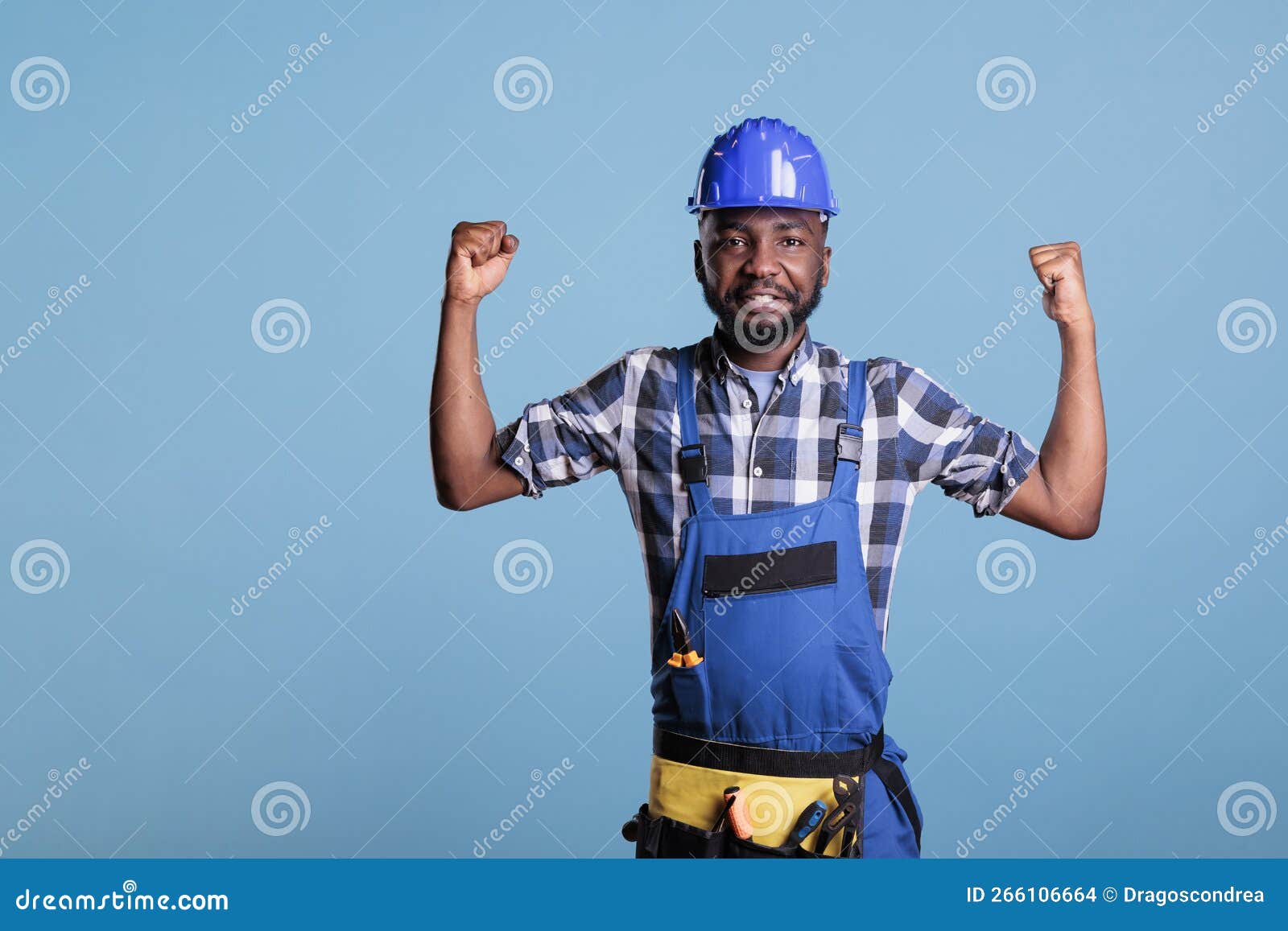 Builder Wearing Overalls Proud of Arm Muscles Stock Photo - Image of ...