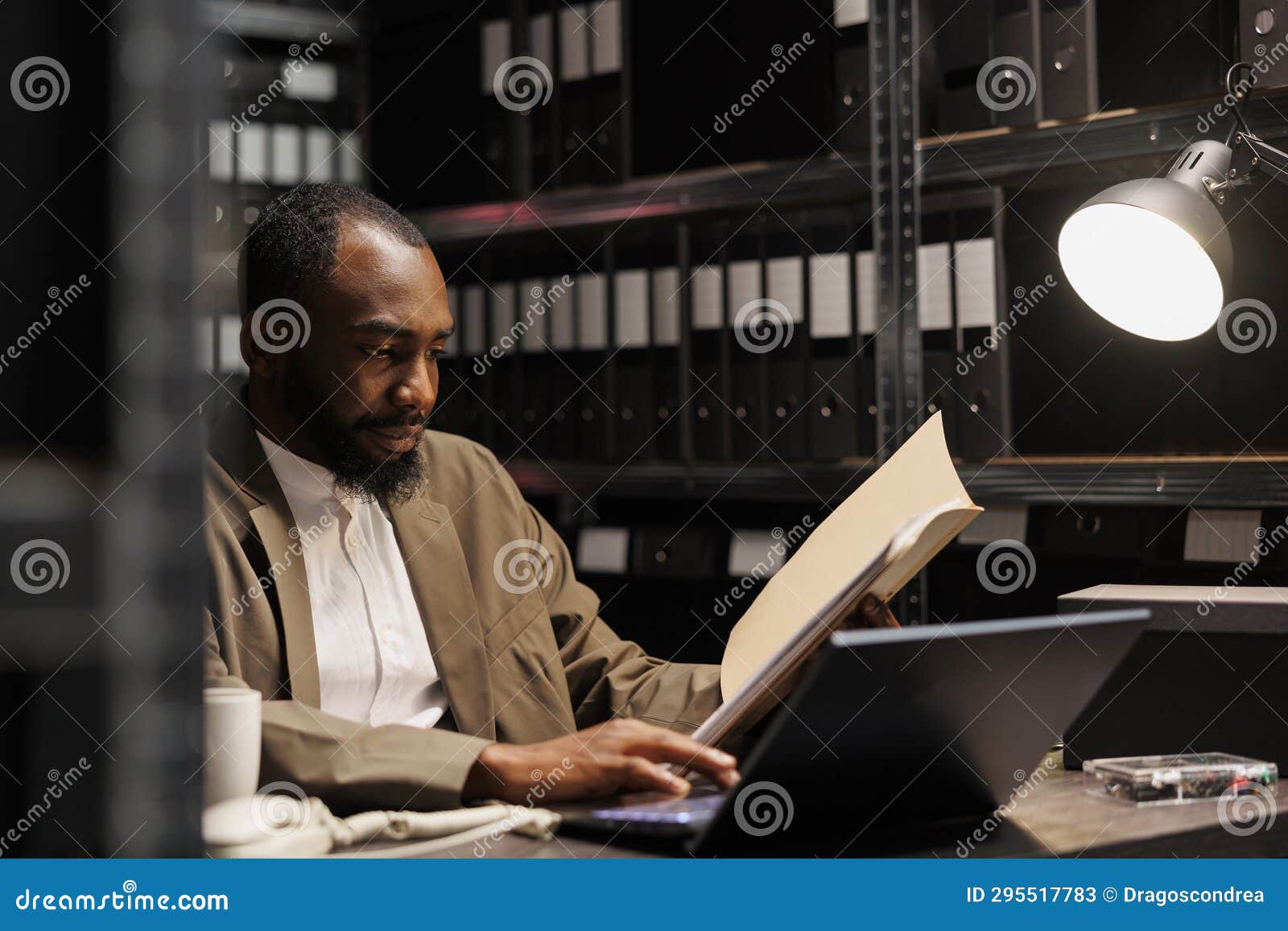 African American Cop Reading Case File, Analyzing Witness Statement ...