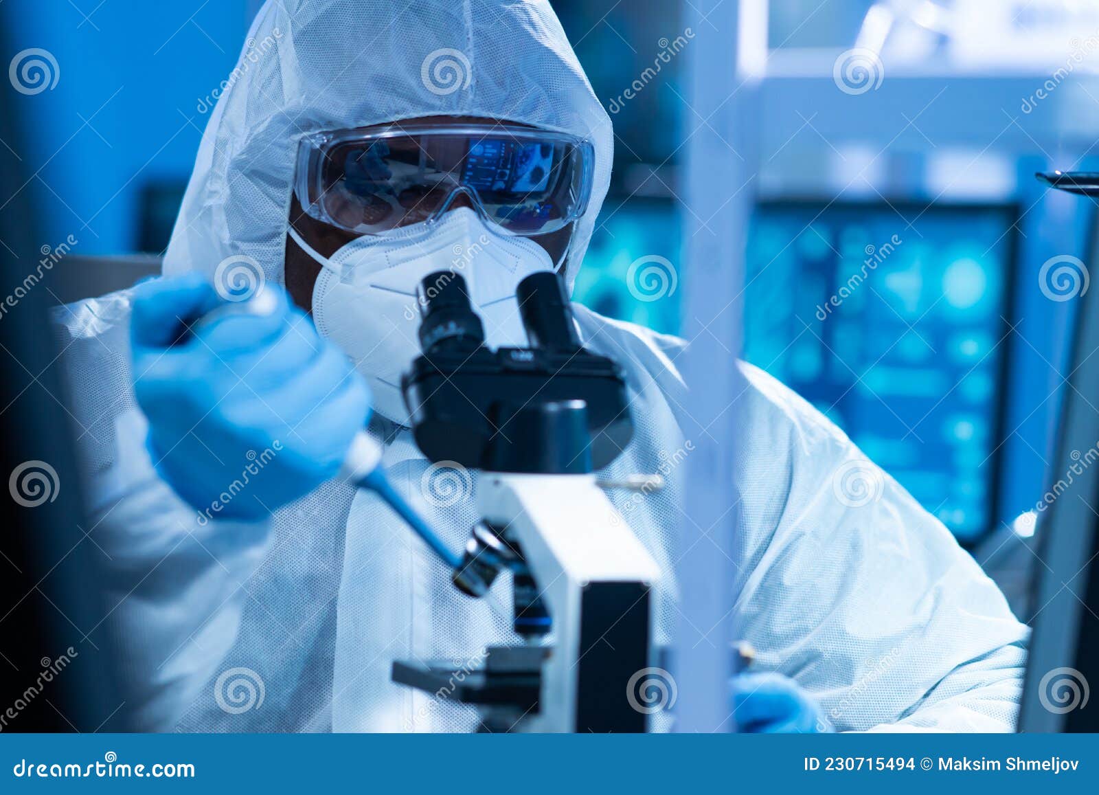 African-american Doctor in Protective Suit is Doing a Science ...